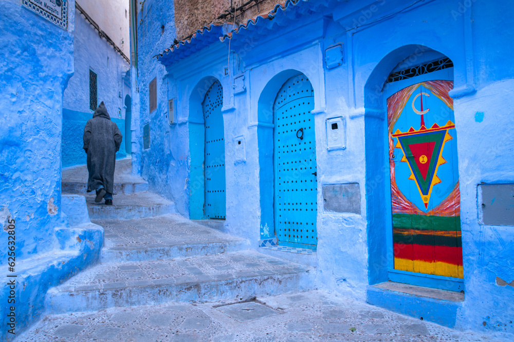 Blue shade of houses, street and alley in Chefchaouen, a city in ...