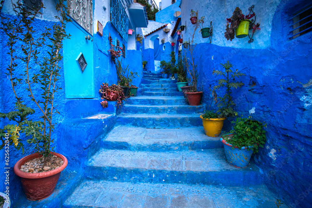 Blue shade of houses, street and alley in Chefchaouen, a city in ...