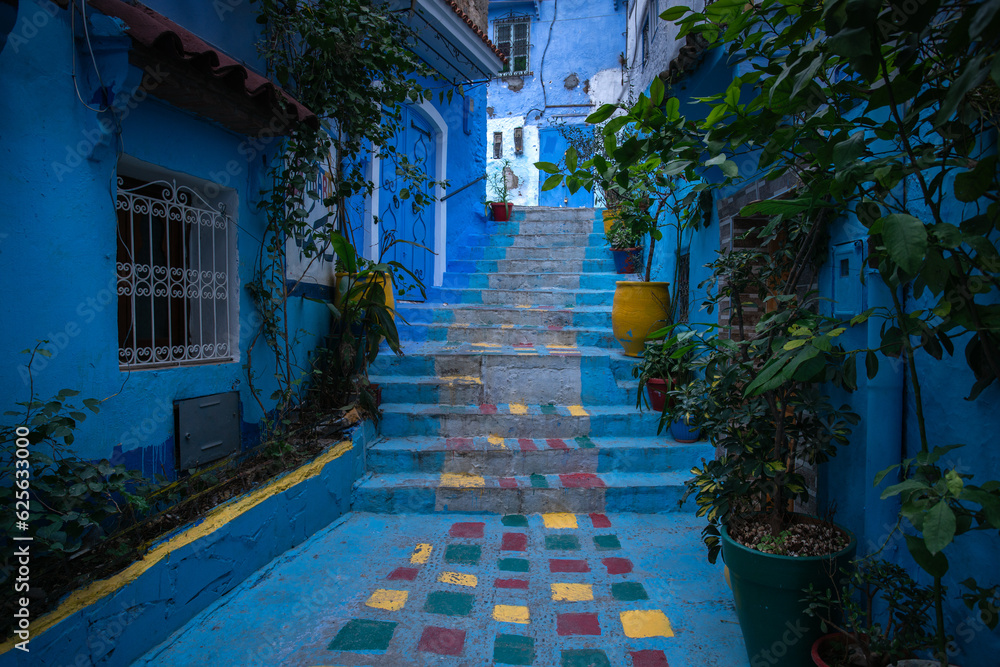 Blue shade of houses, street and alley in Chefchaouen, a city in ...
