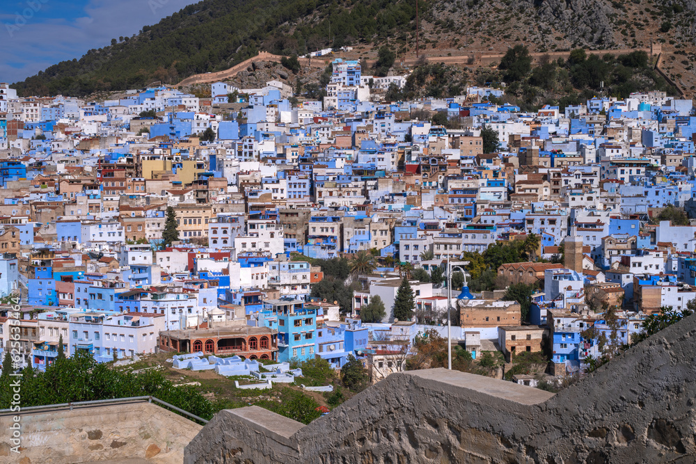 Fotka „Blue shade of houses, street and alley in Chefchaouen, a city in ...