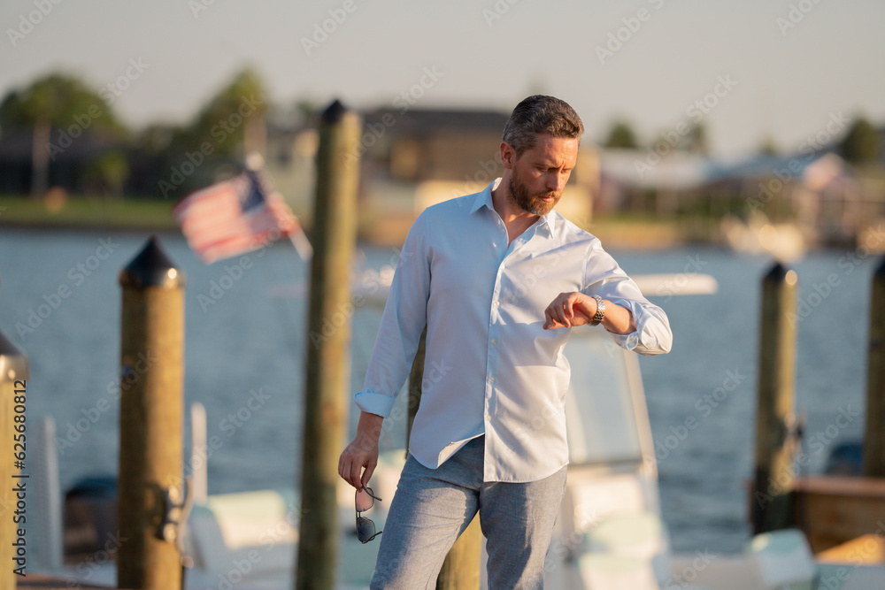 Rich summer business man near the yacht. Portrait of fashion male model ...