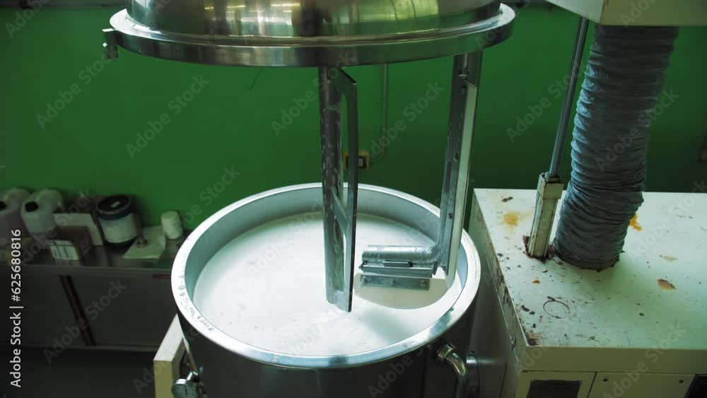 Cream vacuum mixing vessel opening and closing the lid. Automatic ...