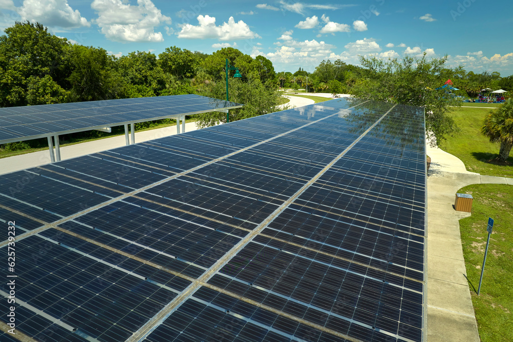Aerial view of solar panels installed as shade roof over parking lot ...