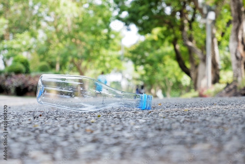 An empty of drinking plastic bottle littering on the ground floor in ...