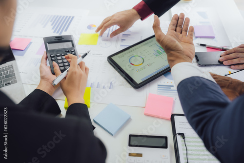 Businessman and team analyzing financial statement Finance task. with ...