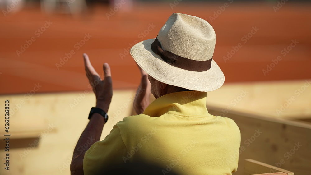 Spectator watching tennis match game clapping hands cheering from ...