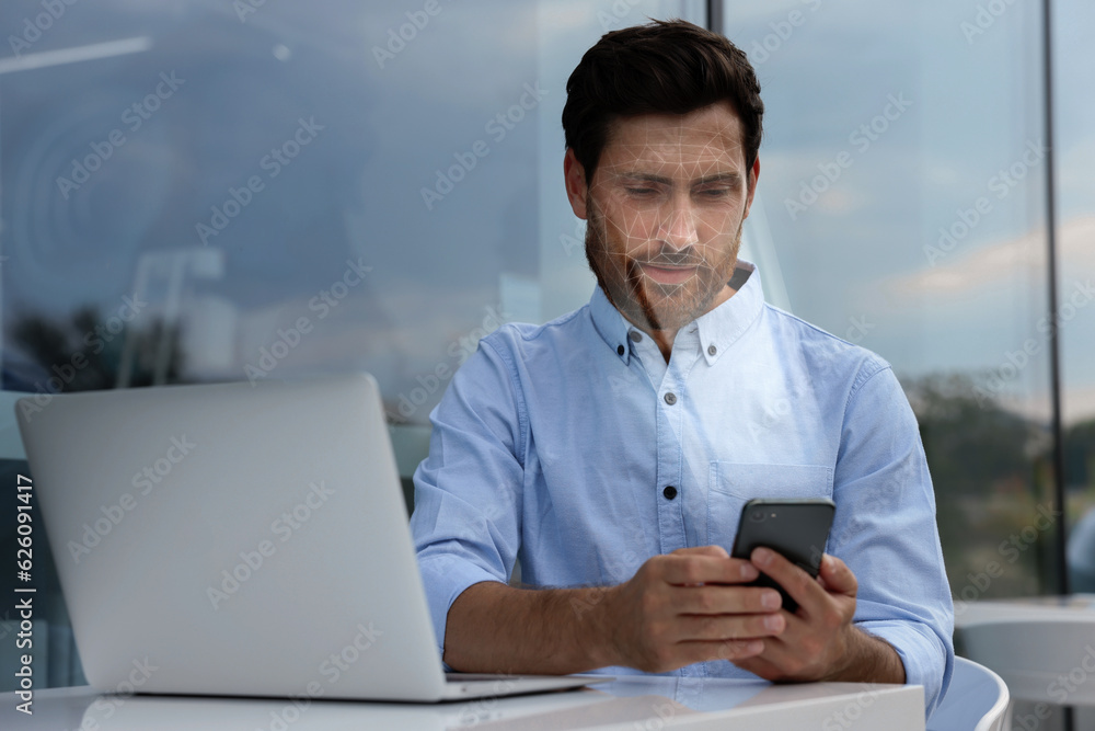 Man Using Smartphone With Facial Recognition System In Cafe Security Application Scanning His