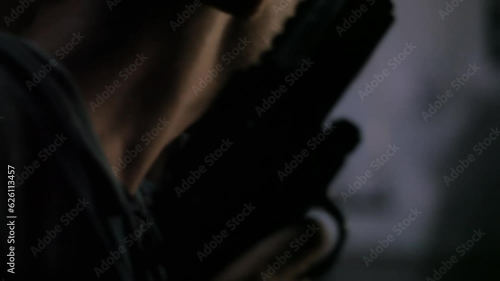 On duty officer with a gun in his hand taking cover of a wall, a man on ...