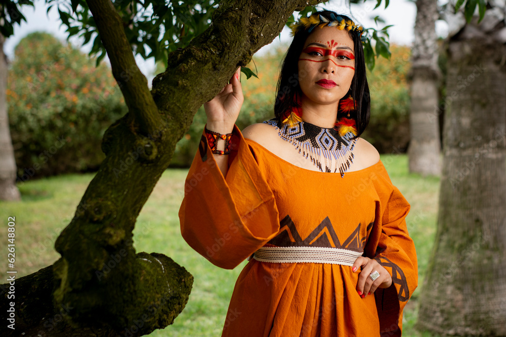 beautiful young peruvian woman of the yanesha culture posing with ...