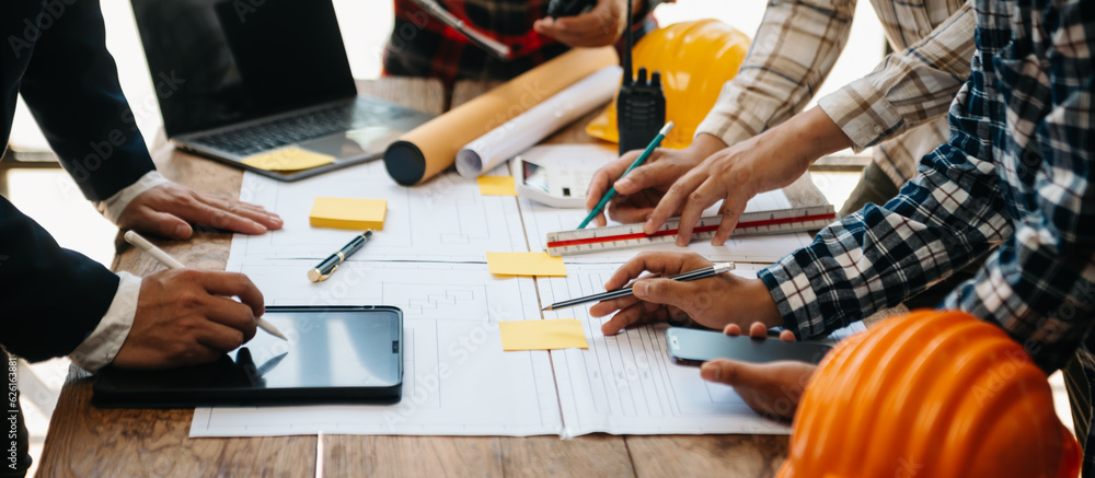 Engineer teams meeting working together wear worker helmets hardhat on ...