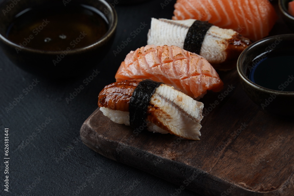 Japanese traditional Cuisine - Set of Nigiri sushi topped with sake ...