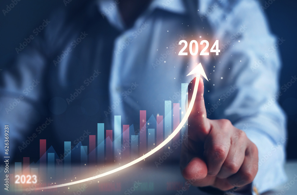 Businessman holding growth graph a year 2024 of business and data ...