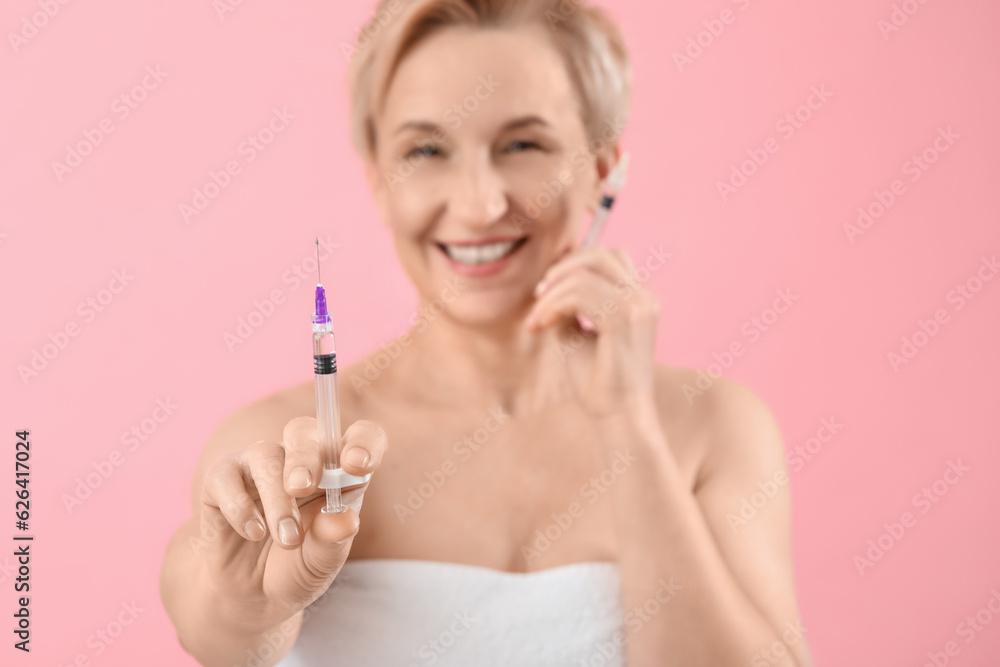 Mature woman with filler injections on pink background, closeup Stock ...