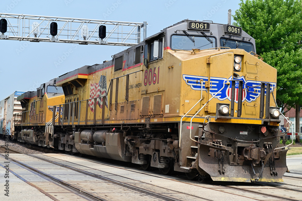 Multiple locomotives lead an Union Pacific freight train through a ...