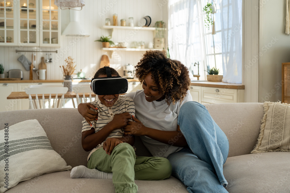 Happy african american mom and son using virtual glasses for play video ...