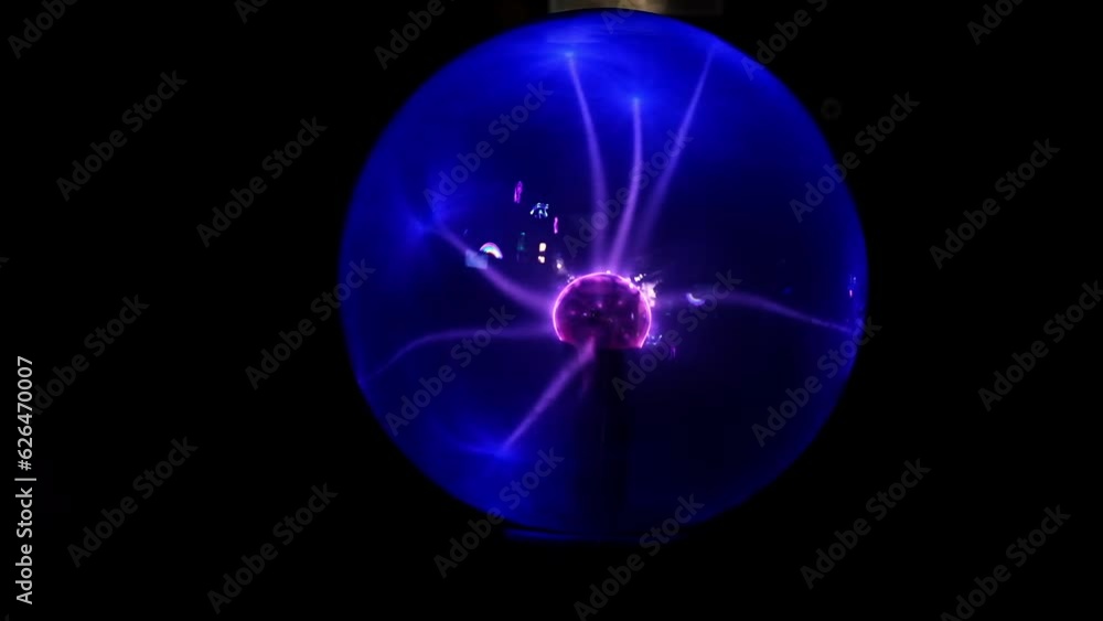 Tesla coil. Plasma globe. Blue and purple light beams. Energy rays ...