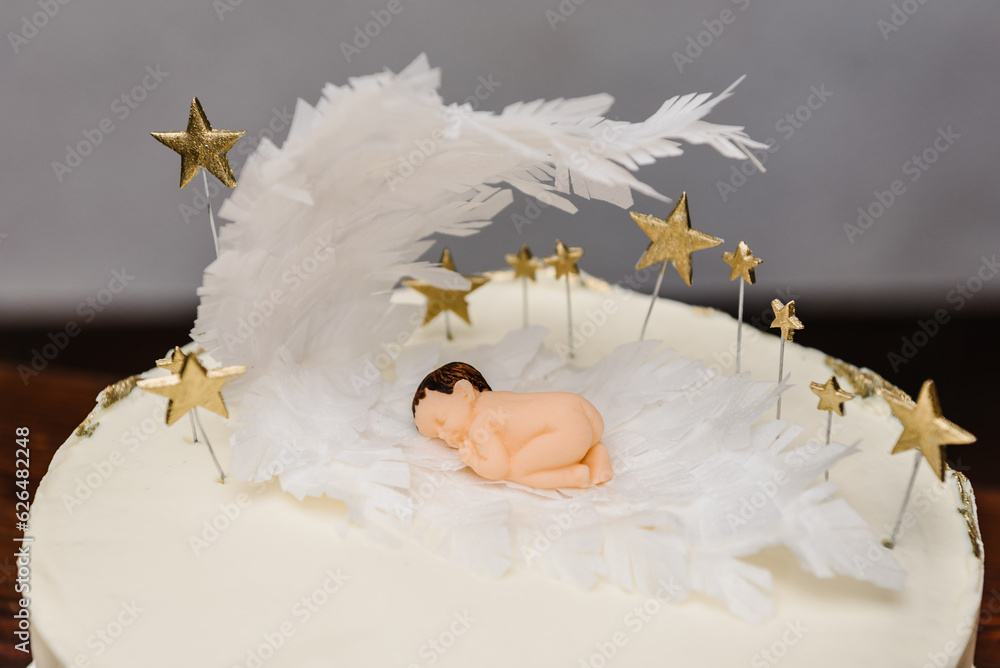 Details trendy cake with figure angel and golden stars. Celebration baptism concept. Delicious ...