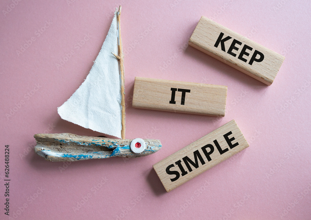 Keep it Simple symbol. Concept words Keep it Simple on wooden blocks ...