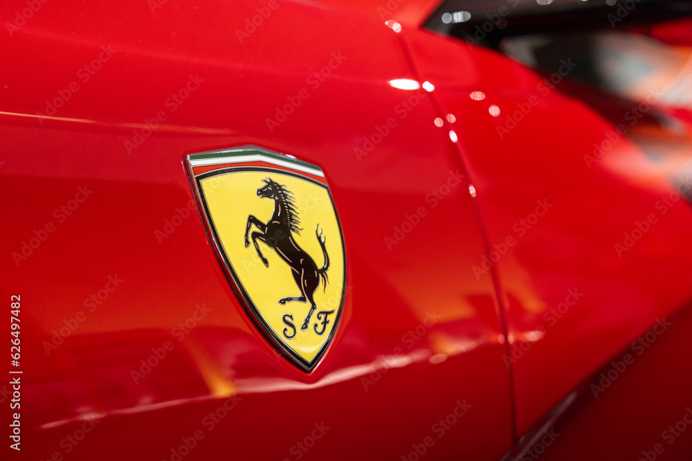 Maranello, Italy - Jul 22, 2023: classic Ferrari logo on red background ...