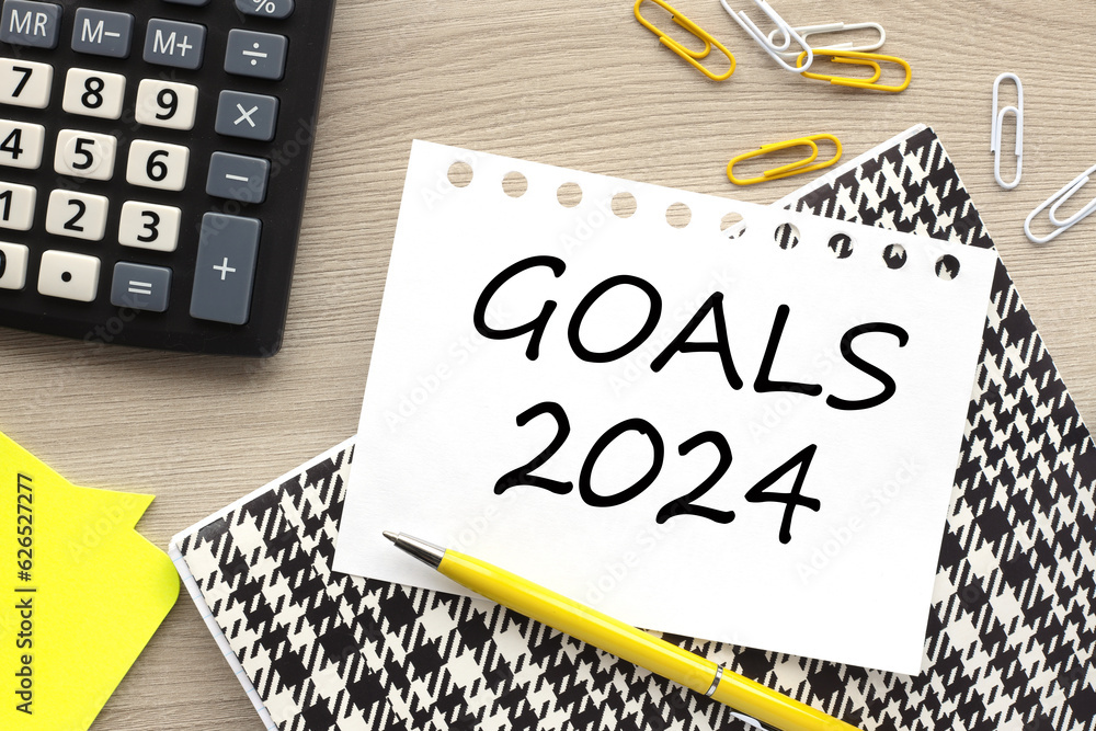 2024 goals year written in notepad. Plans for 2024 with digital ...