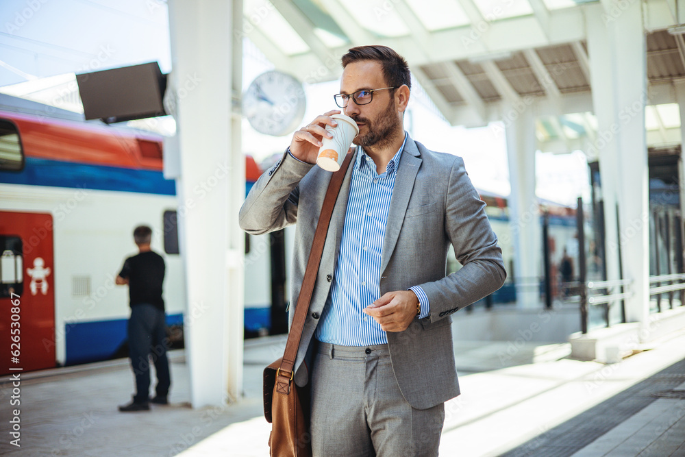 Businessman commuting in the city. Business person is waiting for train ...