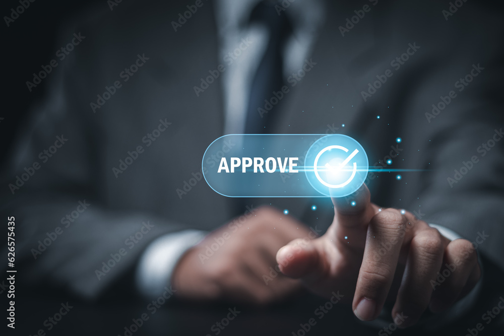 Foto de Approval concept. Businessman touching check mark button to ...