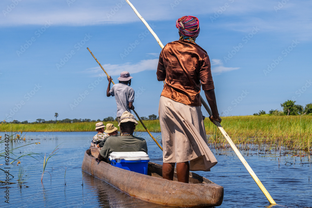 On the road in a dugout canoe through the Okavango Delta, Botswana ...