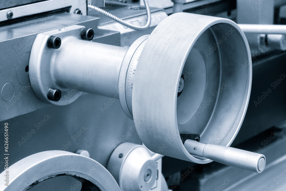 Lathe control knobs close up blue tone. Metal machine tools industry ...