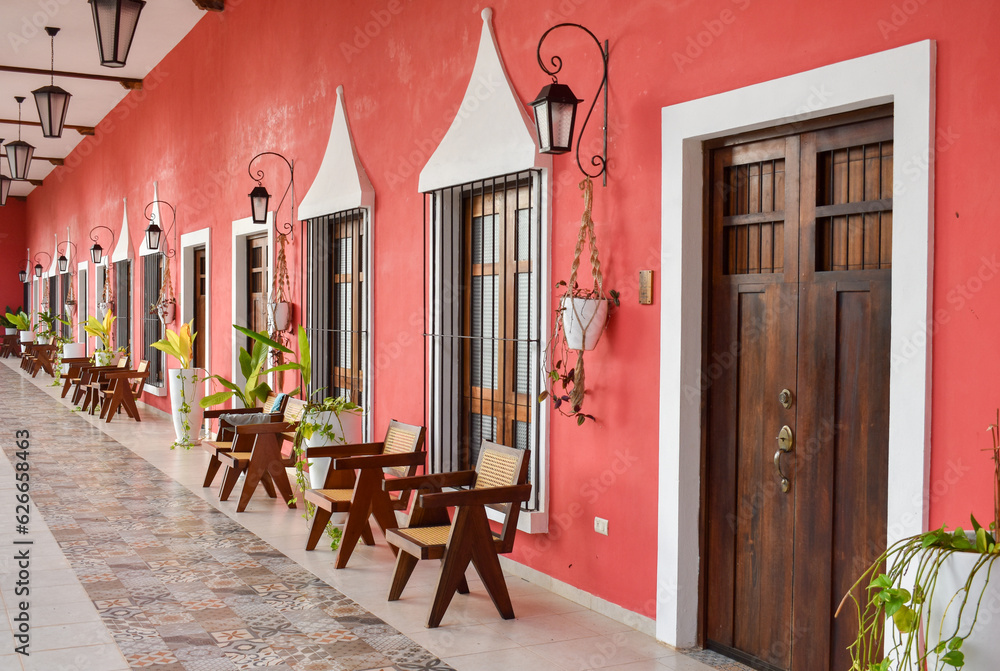 Entrance to the red building of the hotel with columns. cozy house ...
