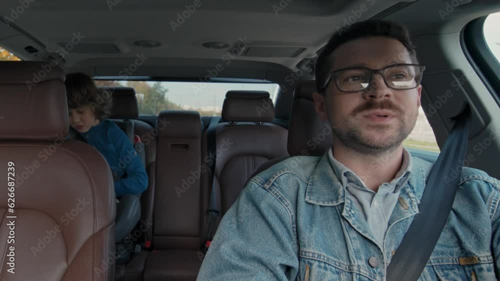 Family of father driver and boy ready to move in car to school and ...