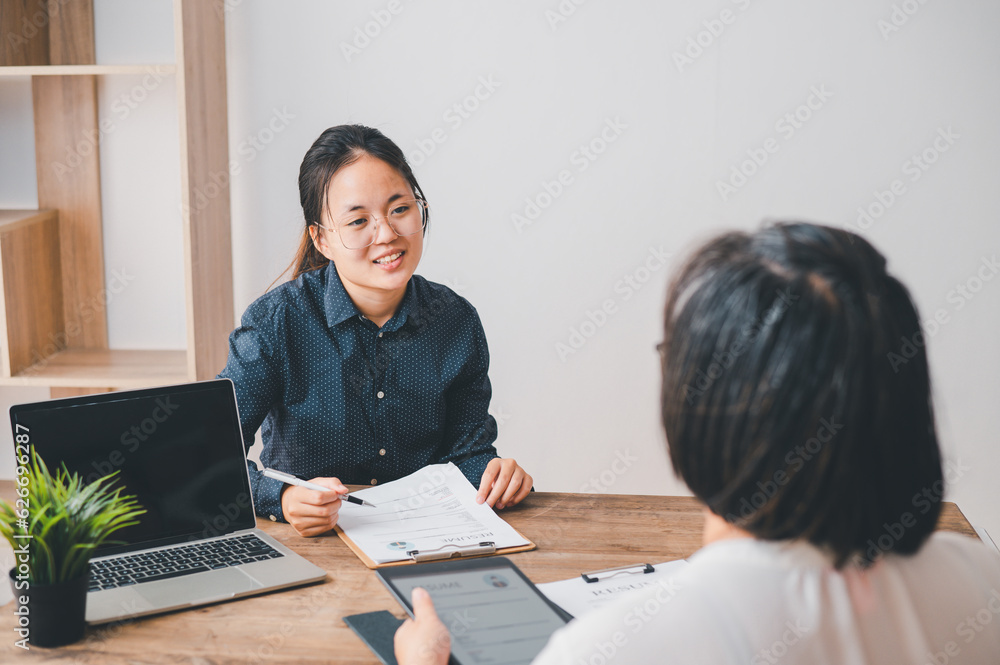HR managers are interviewing job applicants who fill out their resume ...