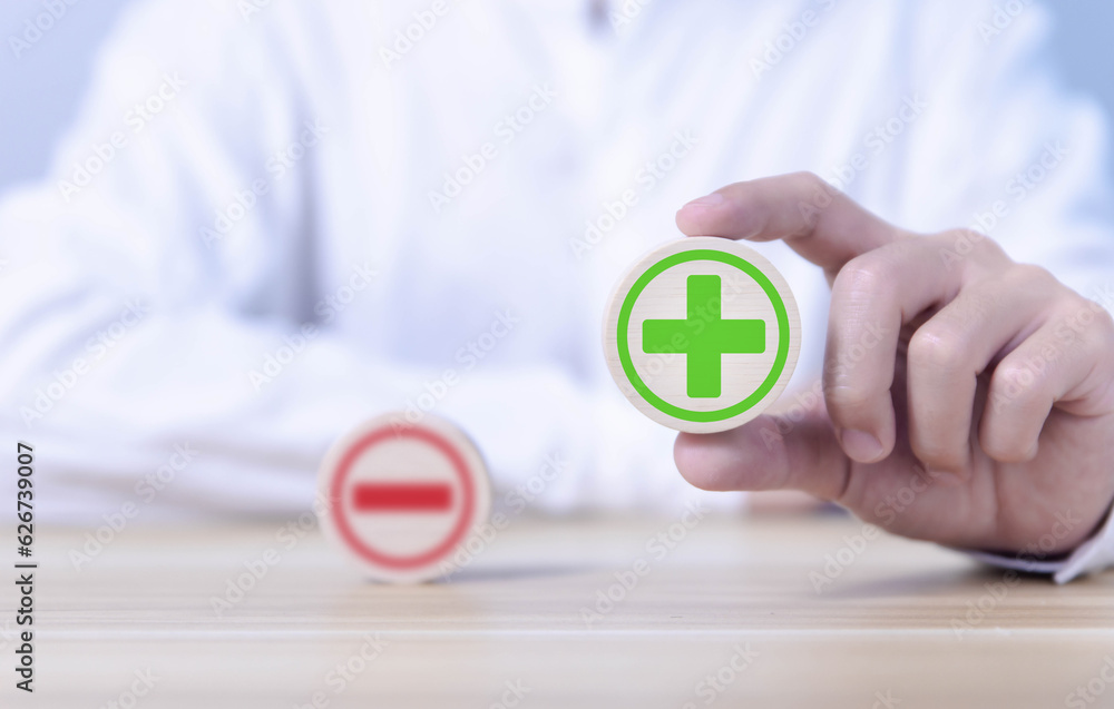 wood block shows plus and minus symbols. The concept of opposites ...