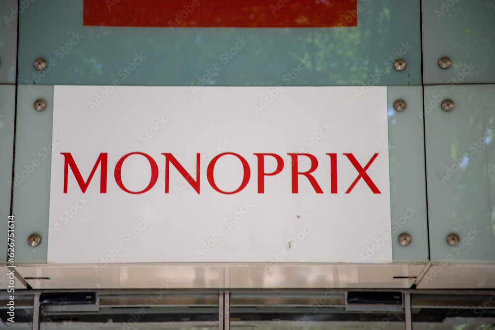 Monoprix logo brand and red sign text on wall entrance city shop ...