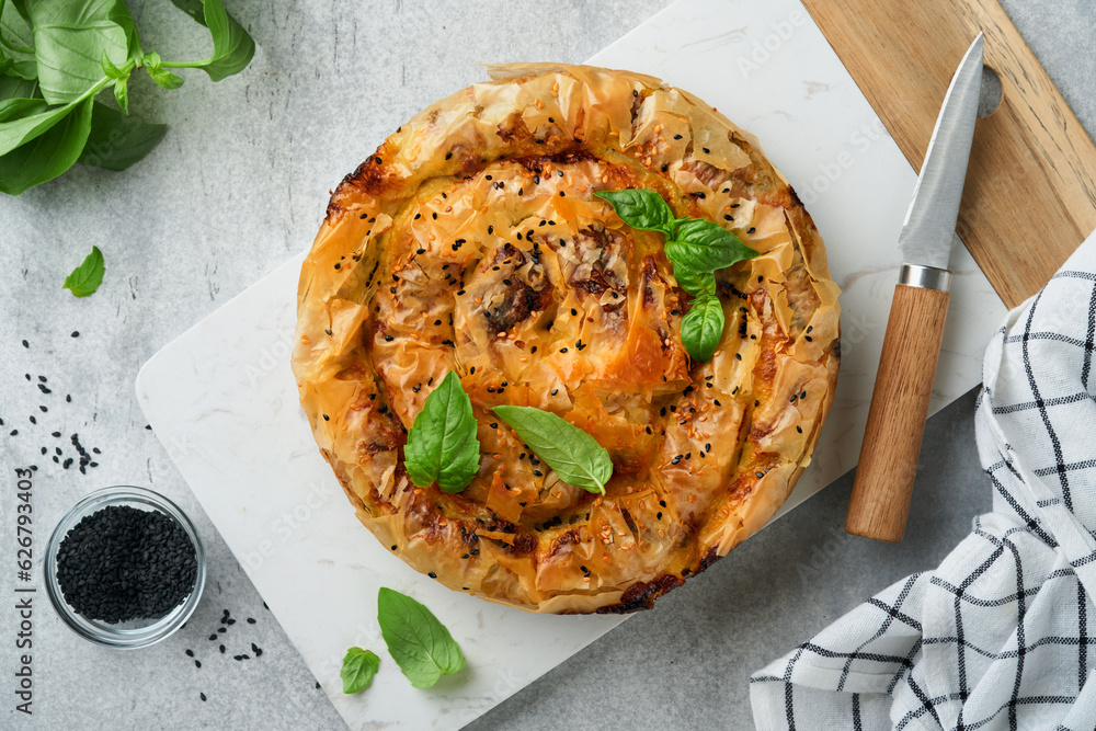 Delicious pie Spanakopita with soft feta cheese and spinach on old gray ...