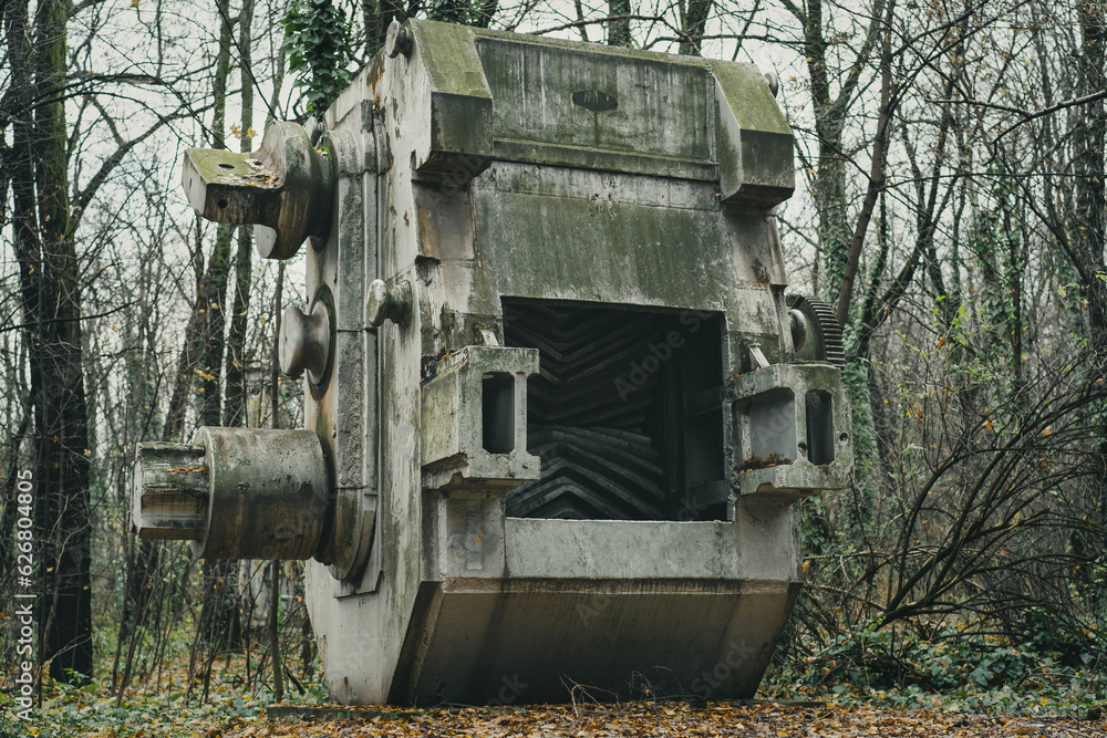 Old ore grinding machine in the forest. Abandoned machines of ...