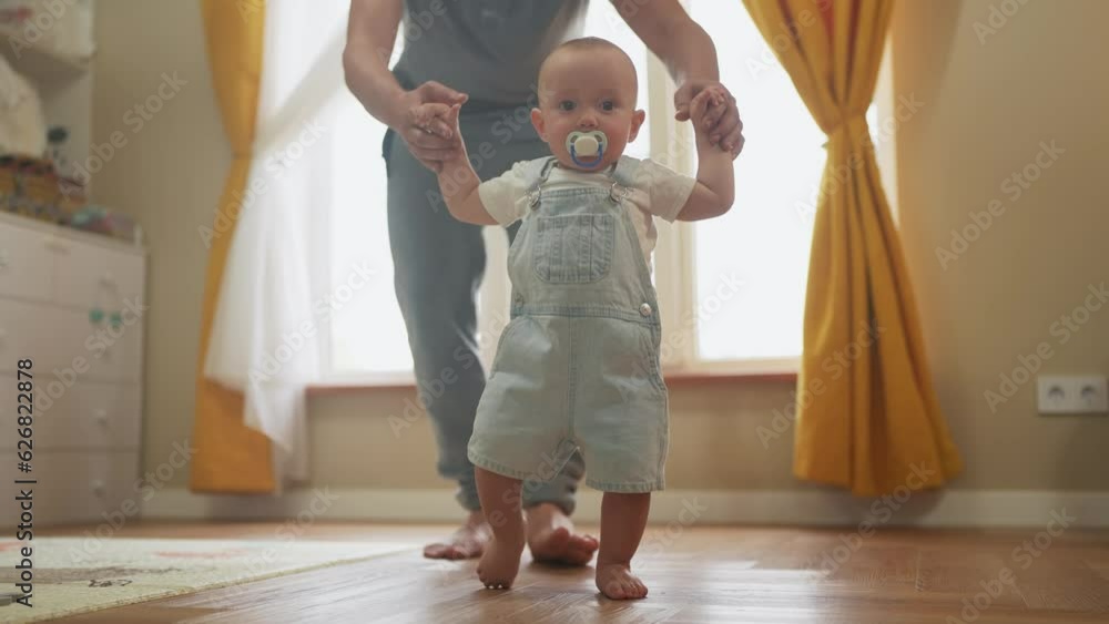 baby first steps. daddy a teaches baby toddler son to take first steps ...