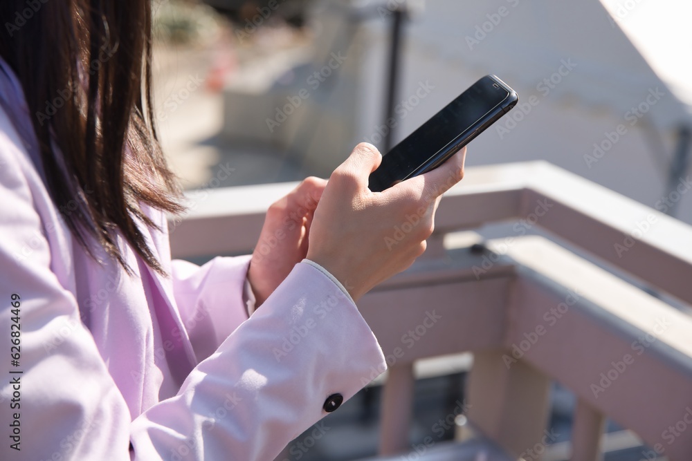 Body parts of hands using smartphne by Japanese woman at the street ...