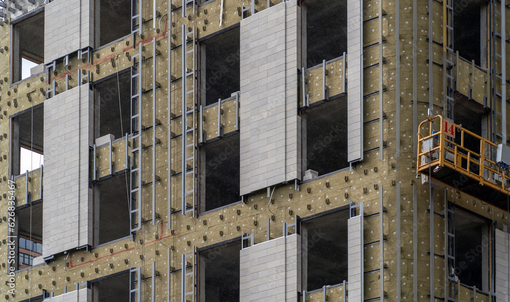 Installation of external wall thermal insulation with rock wool ...