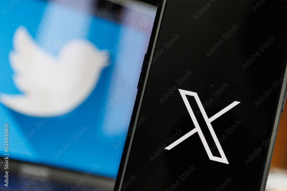X logo and the twitter logo on the screen. Stock Photo | Adobe Stock