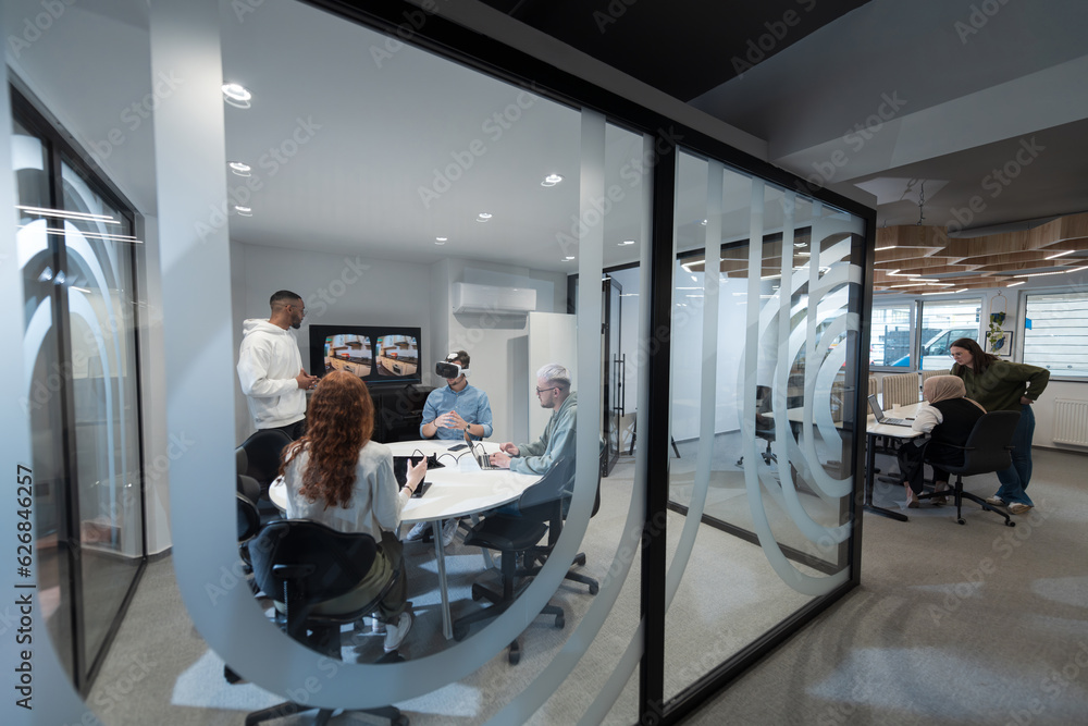 A diverse group of businessmen collaborates and tests a new virtual ...