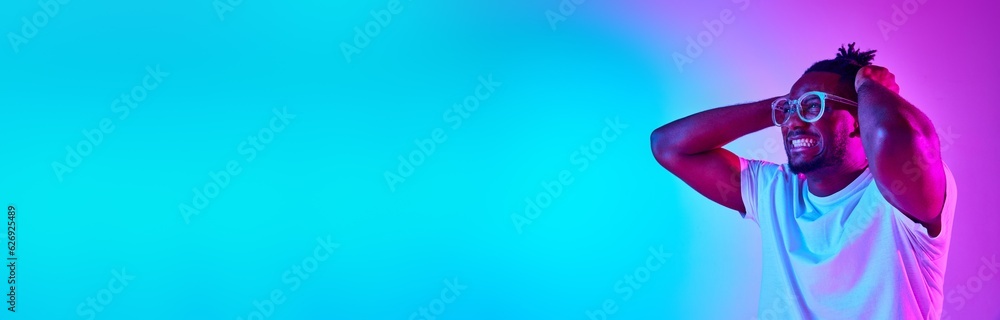 Banner with african man in glasses looking away, scared, shocked and ...