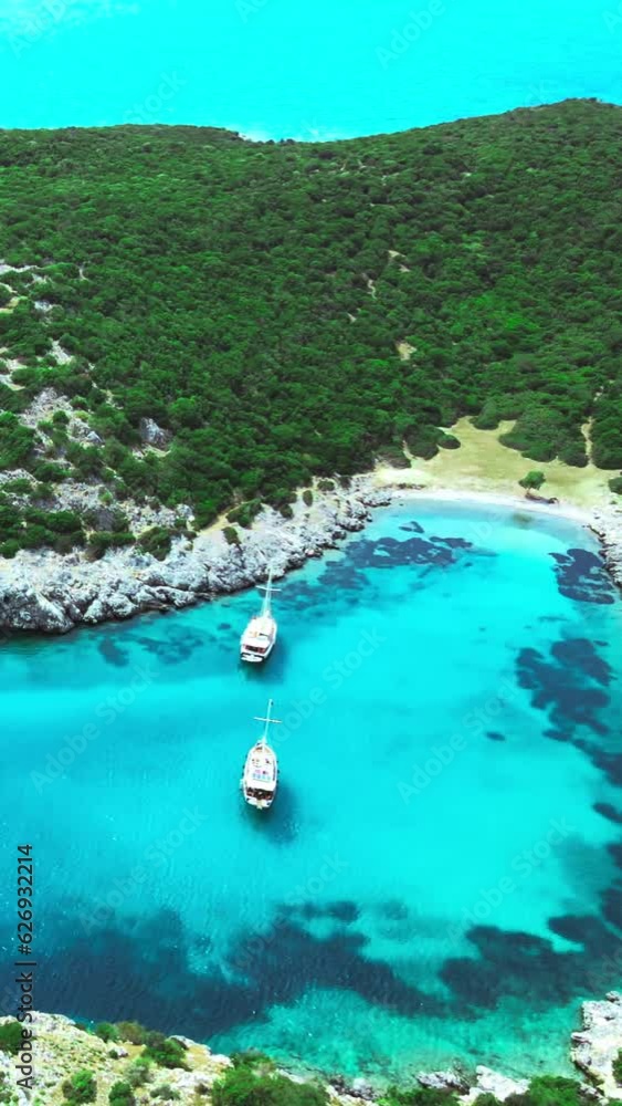 Aerial vertical shot with Akvaryum koyu bay in Bodrum with yachts and ...
