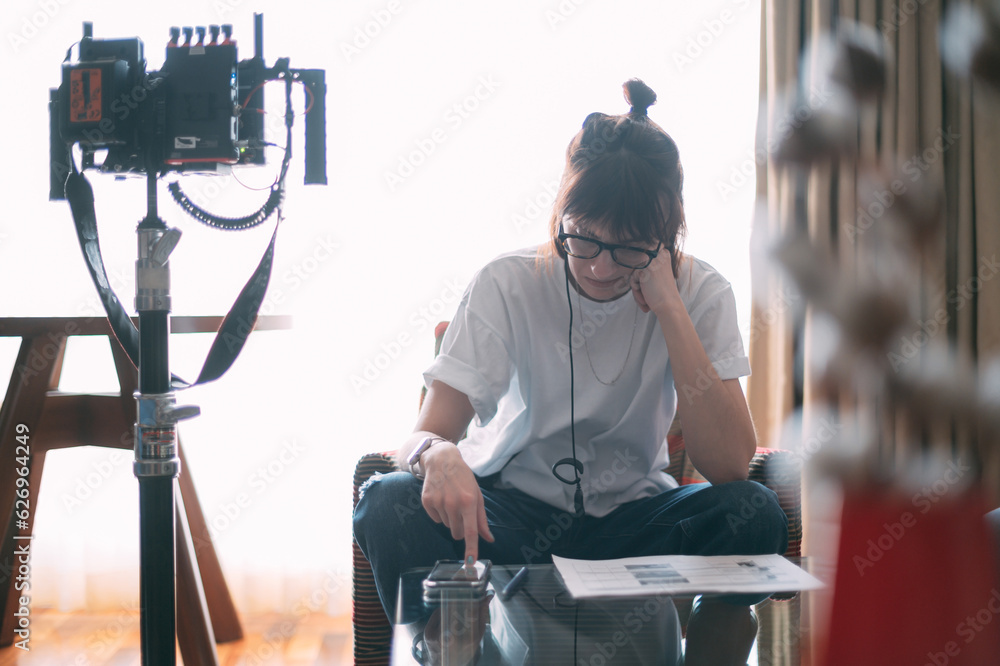 The director is a woman at work on the set. The director works with a ...