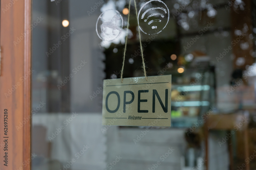 owner show sign open on the first day of business. guarantees safety ...