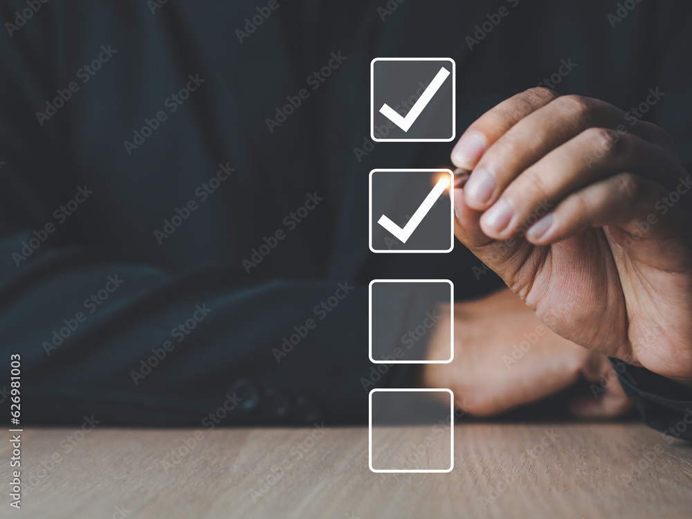 Foto de quality assurance concept Businessman using pen to make correct ...