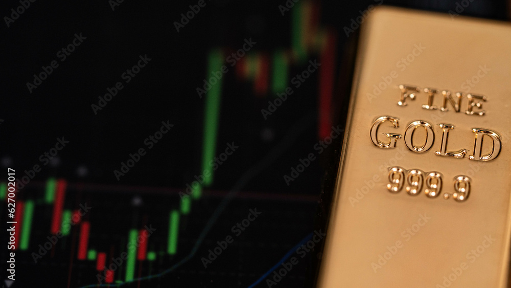 gold bars place on the phone that opens the candlestick chart ...