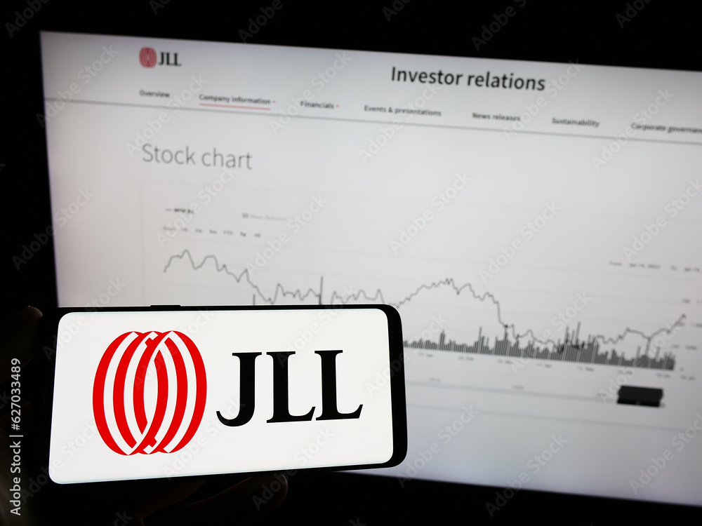 Stuttgart, Germany - 07-15-2023: Person holding mobile phone with logo ...