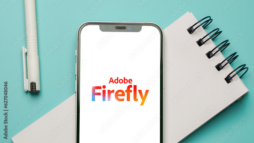 Adobe Firefly logo displayed on mobile phone screen, AI Art generator ...