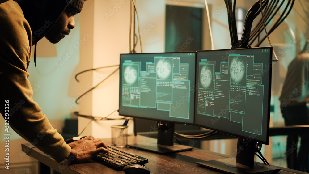 African american spy copying important data from hard disk, using drive ...