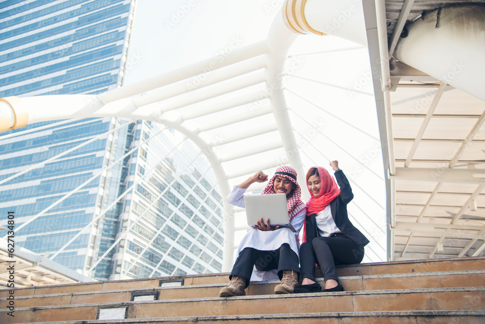 Arab team hold digital tablet uae union teamwork people. Digital ...